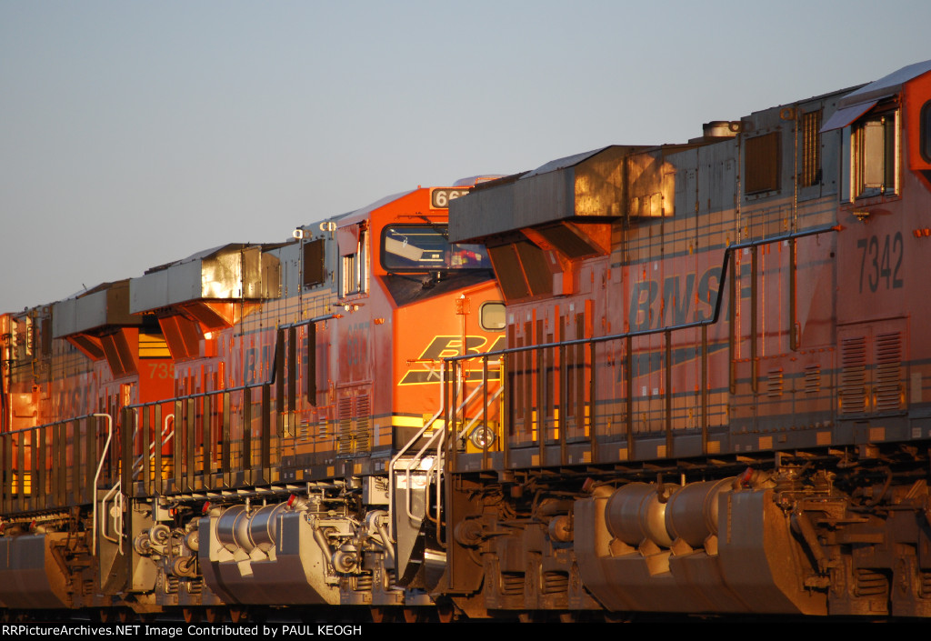 BNSF 6677 heads eastbound into the Rising California Sunrise as a #2 unit/
